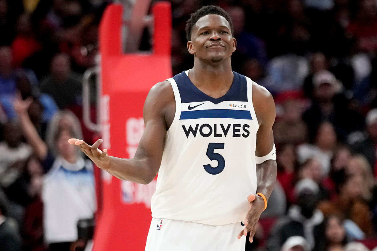 NBA star Anthony Edwards held back in fiery courtside clash with fan ...