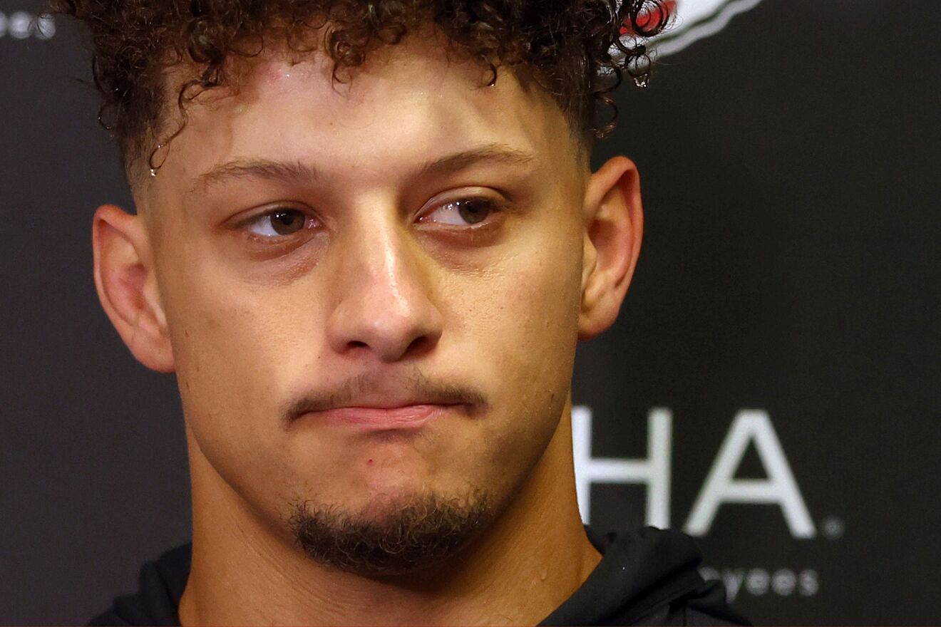 Patrick Mahomes tries a challenge with a football and the Kansas City ...